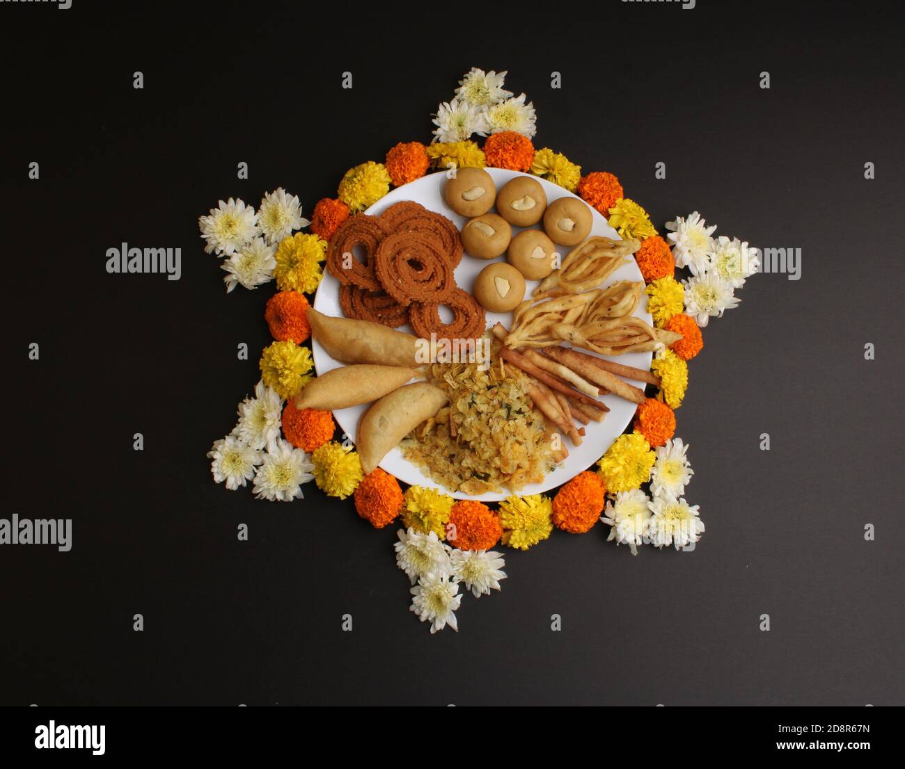 Plate full of indian festival food or diwali food or snacks like laddu ...