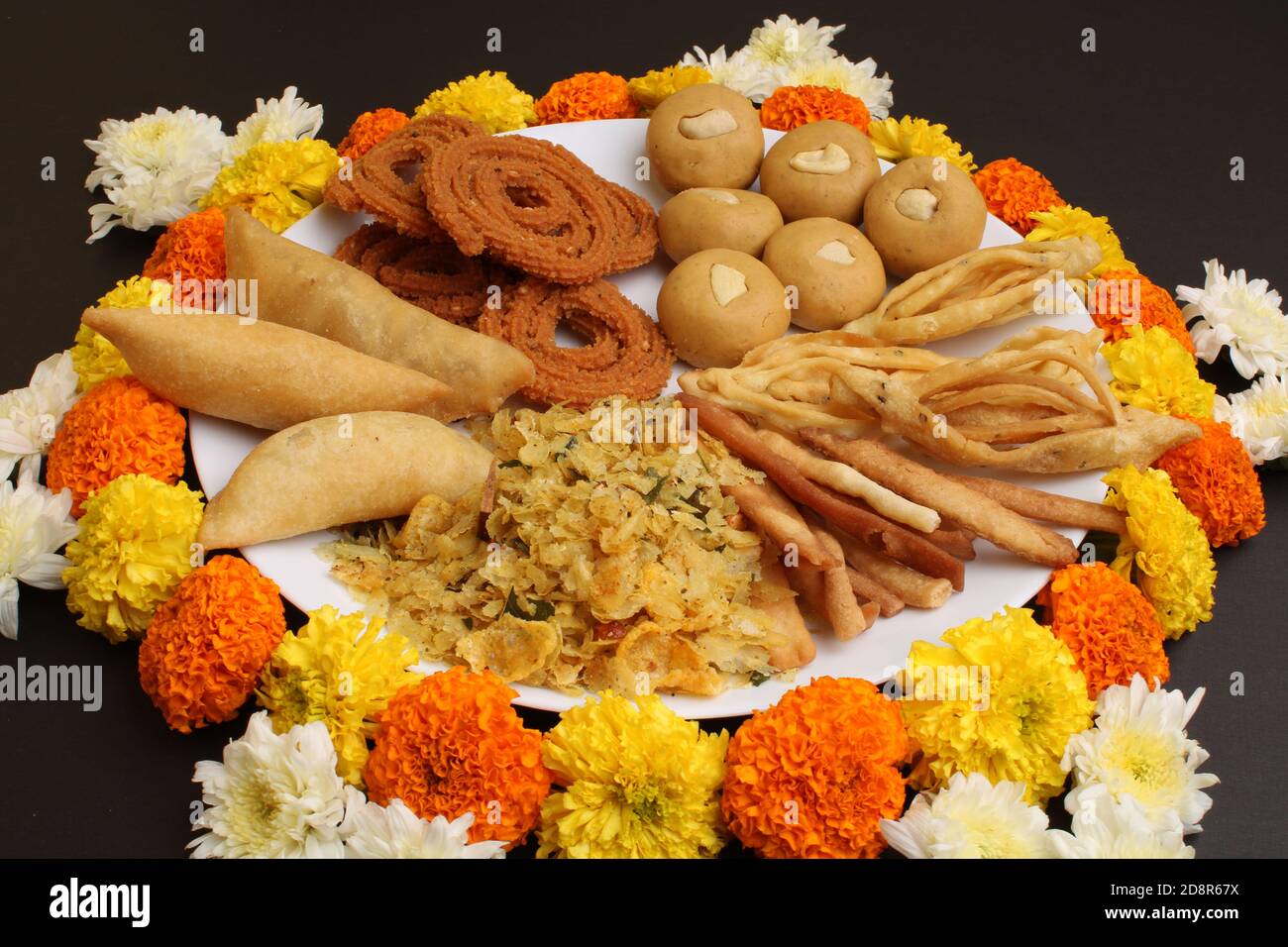 Plate full of indian festival food or diwali food or snacks like laddu ...