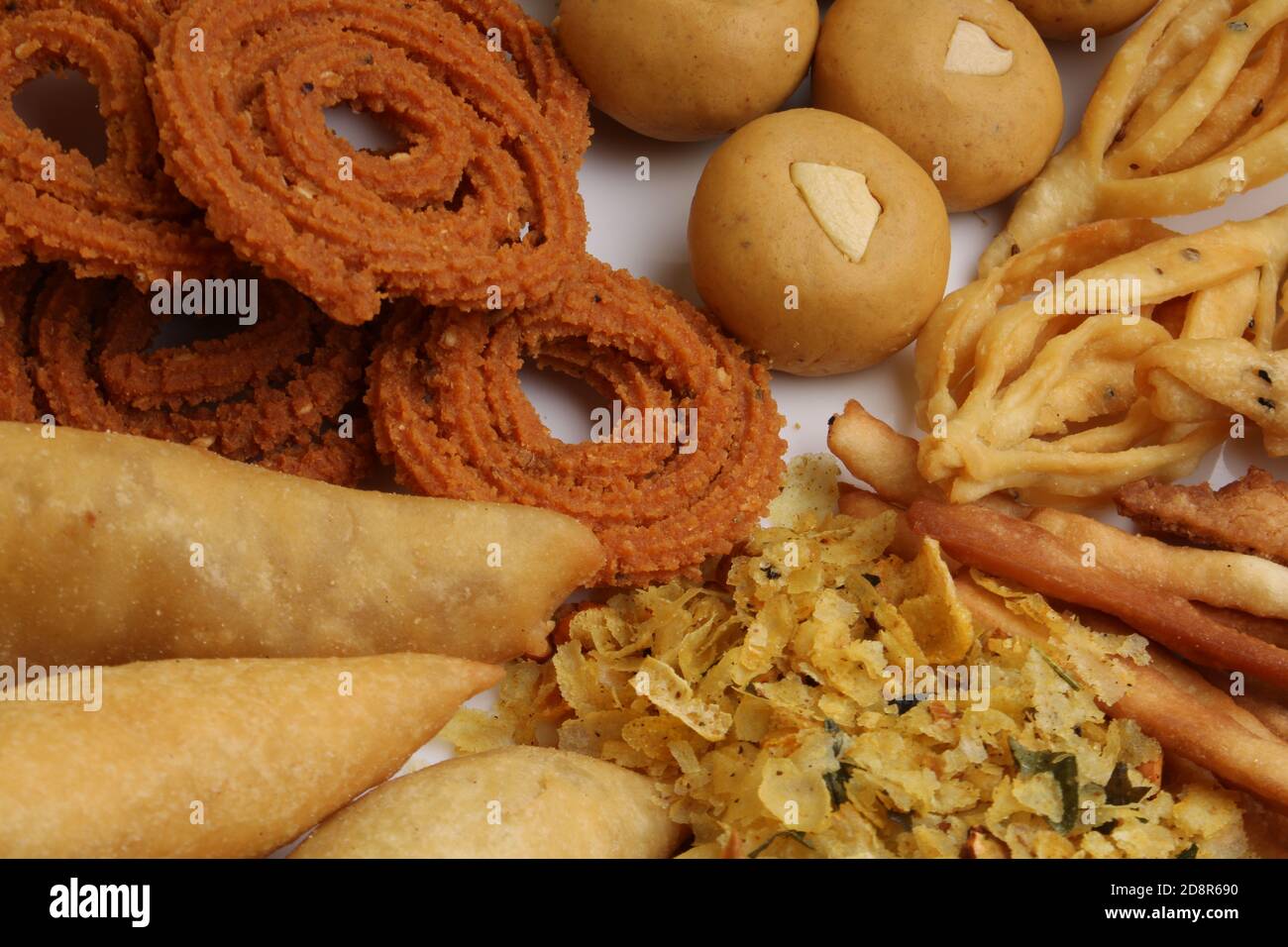 Plate full of indian festival food or diwali food or snacks like laddu ...