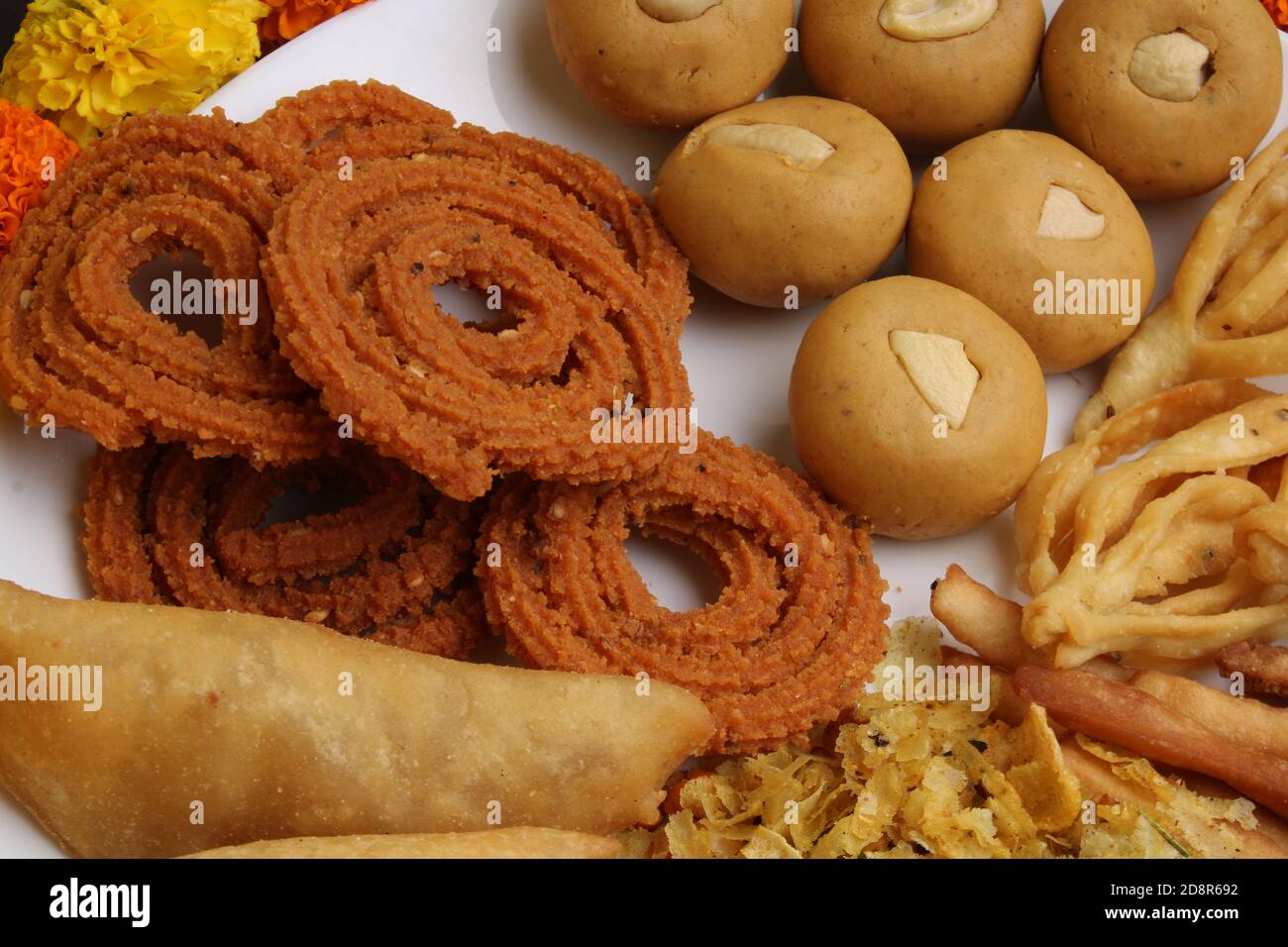 Plate full of indian festival food or diwali food or snacks like laddu ...
