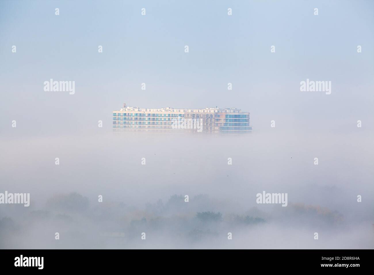 Highrise building under construction in the fog Stock Photo - Alamy