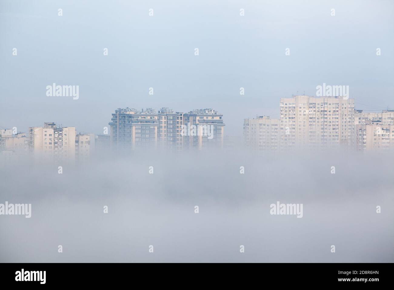 Highrise residential buildings in the fog in morning Stock Photo - Alamy