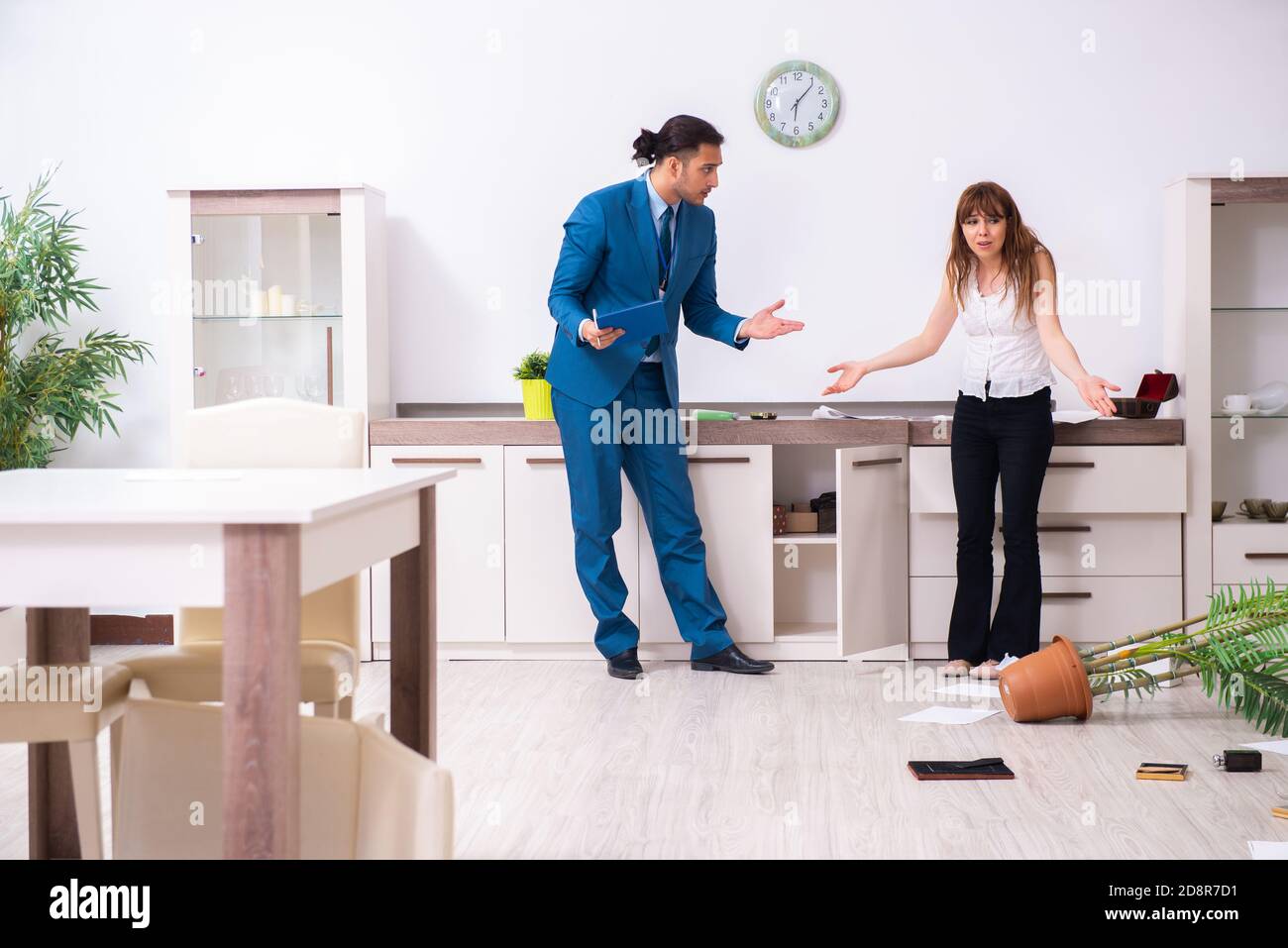 Female owner and police officer in housebreaking concept Stock Photo ...