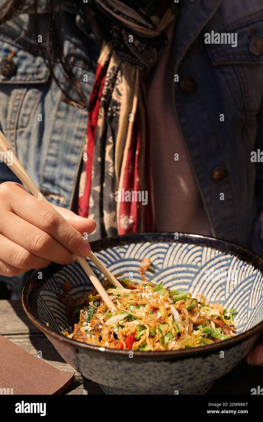 Asian dish set on wood table, bowl and chinese sticks Stock Photo - Alamy