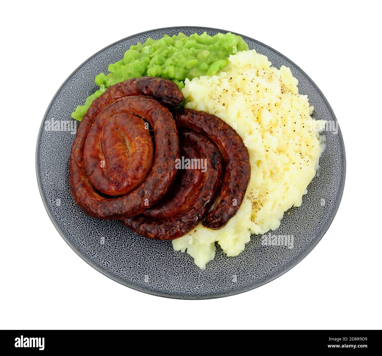 Cumberland pork sausage swirl and mashed potato meal with mushy peas ...