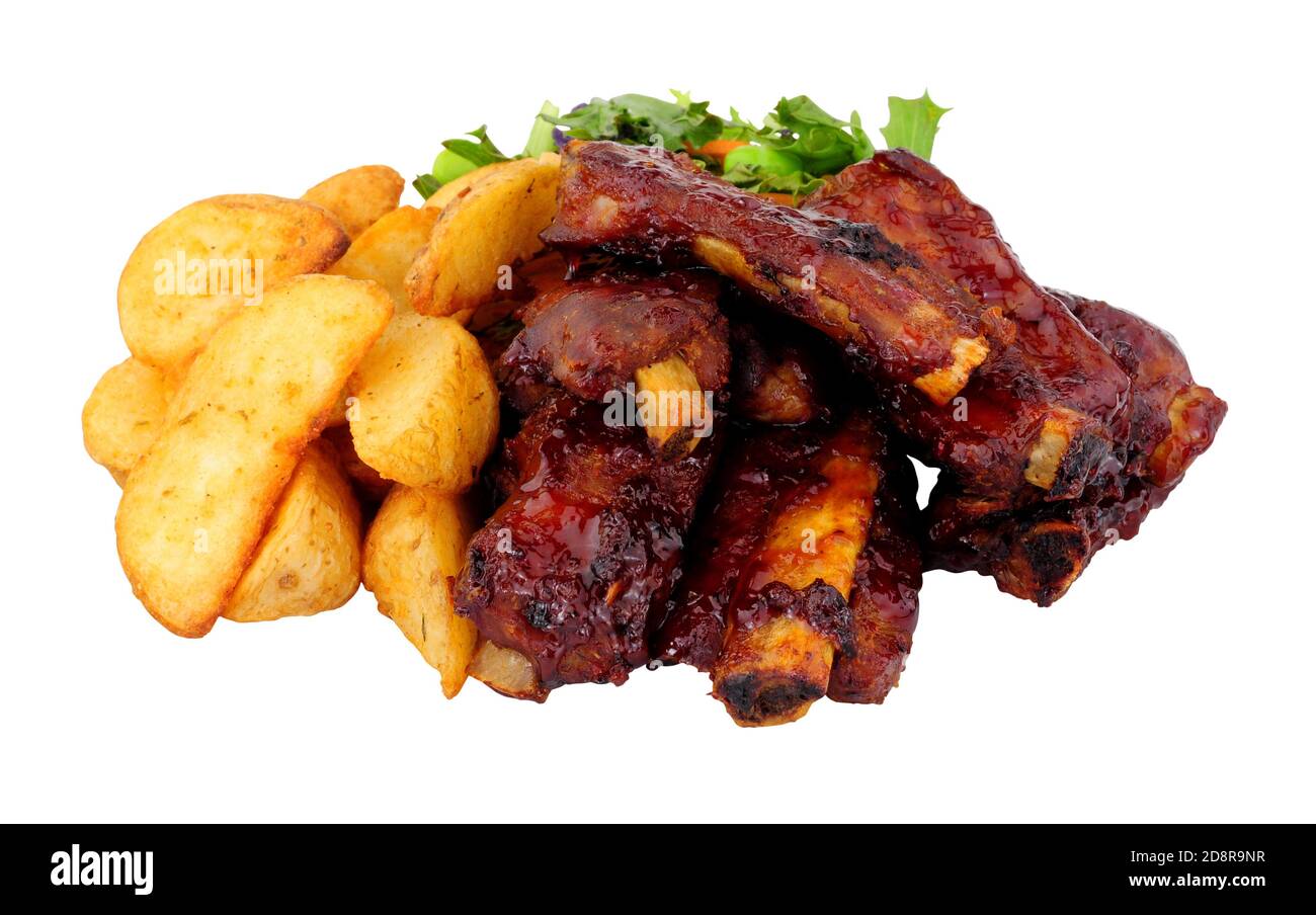 Mini barbecue pork ribs and potato wedges meal with salad isolated on a ...