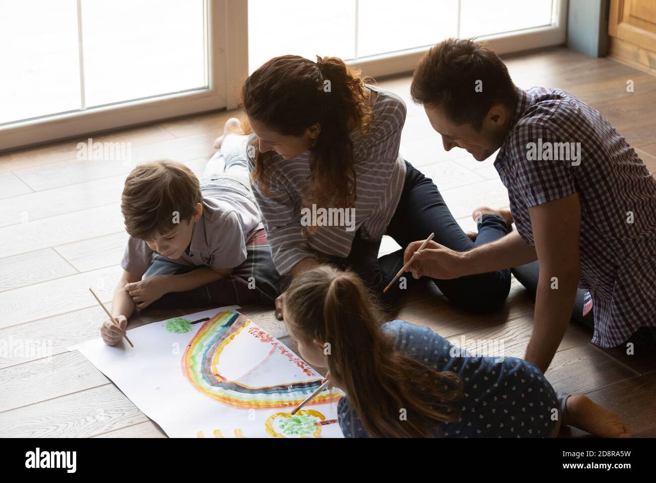Happy family with kids have fun drawing at home Stock Photo - Alamy