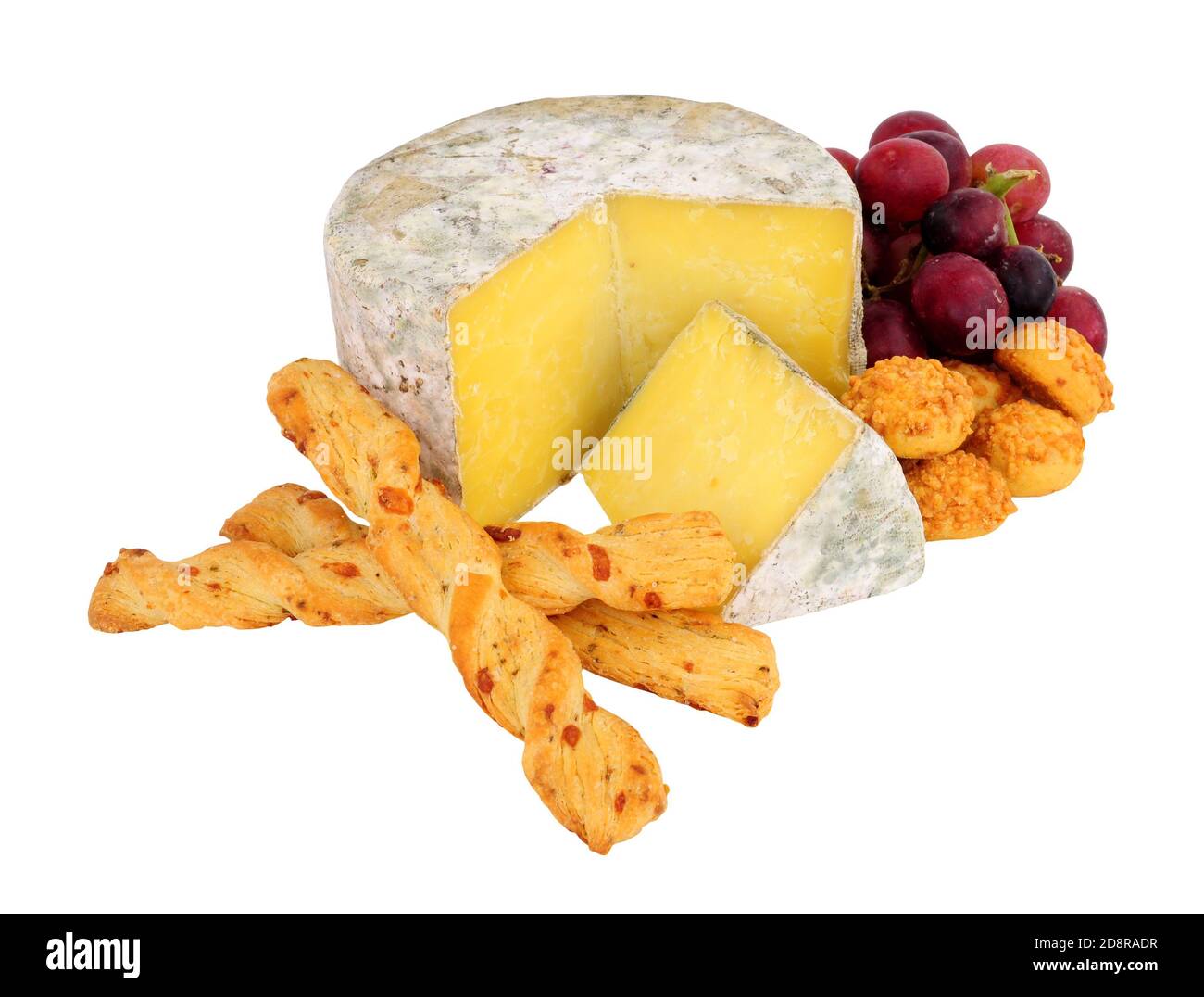 Farmhouse cheddar cheese wheel with red grapes and crispy baked cheese ...