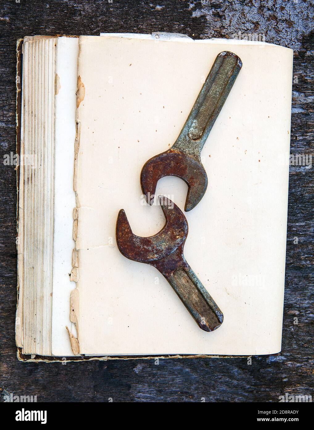 Old Rusty Tools on the Old Book and Wooden Background closeup Stock ...