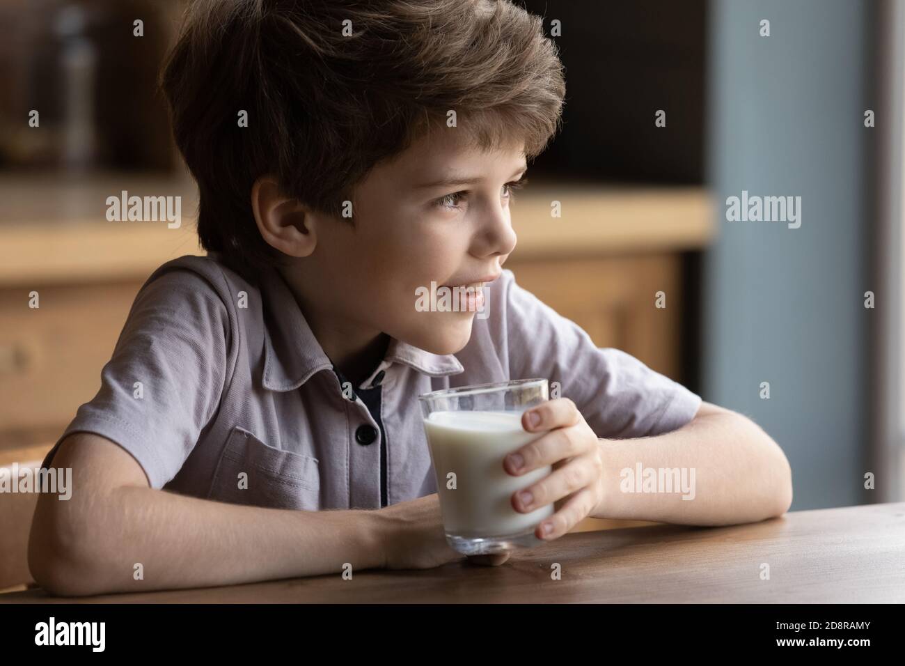 Small boy drink tasty organic milk from glass Stock Photo - Alamy