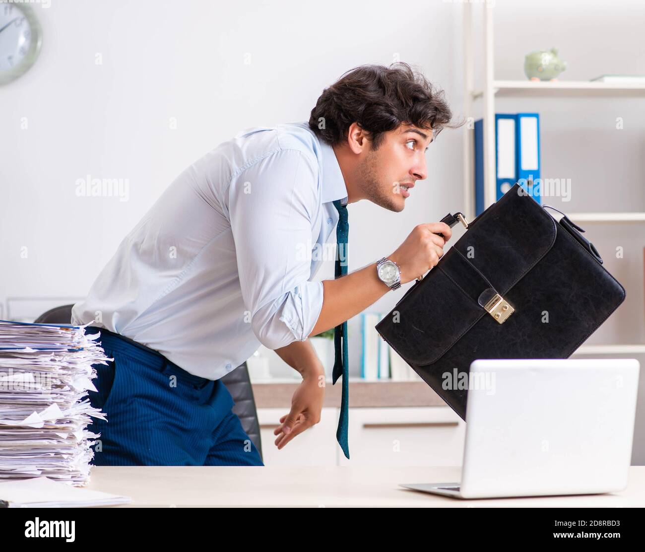 The overloaded busy employee with too much work and paperwork Stock ...