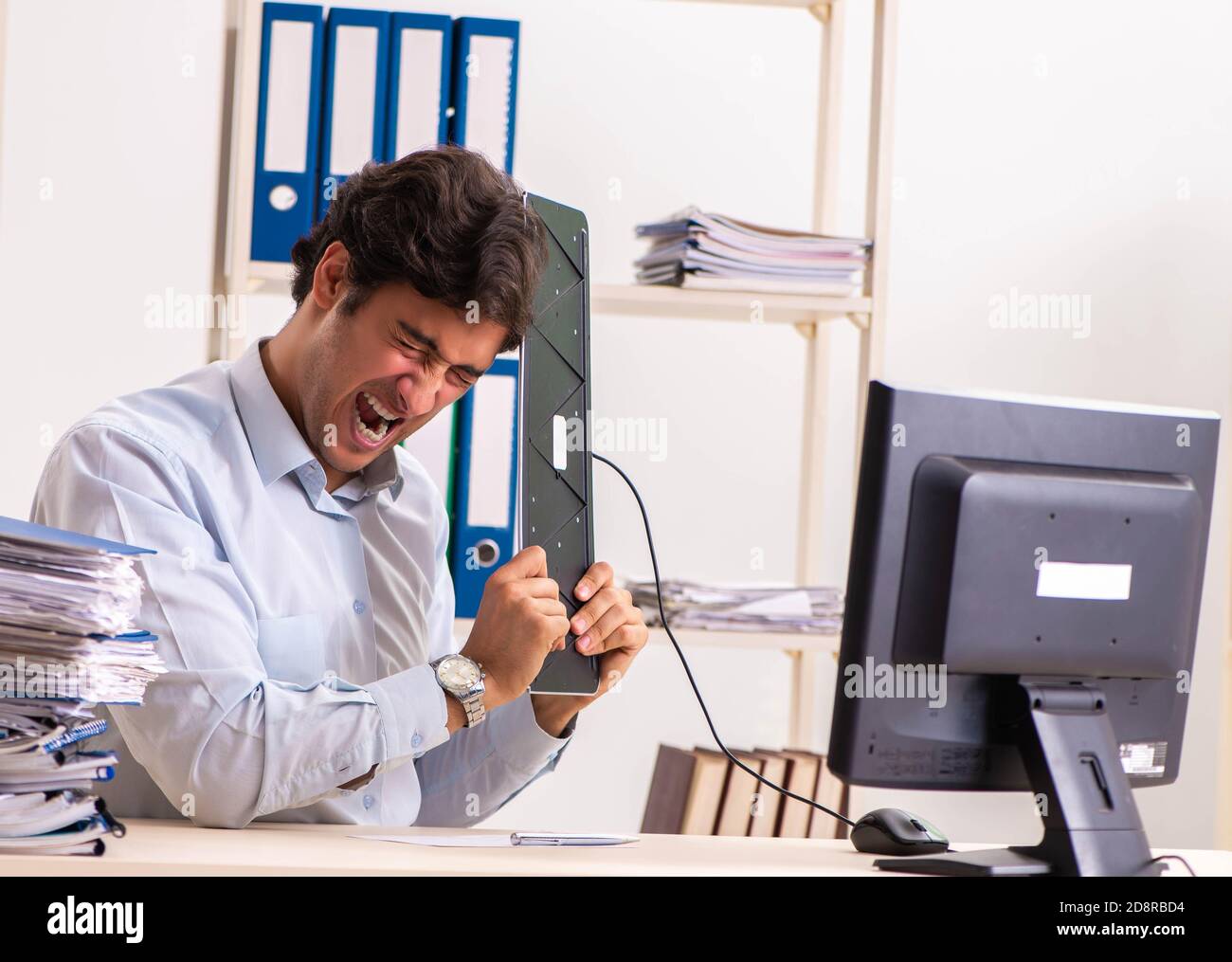 The overloaded busy employee with too much work and paperwork Stock ...