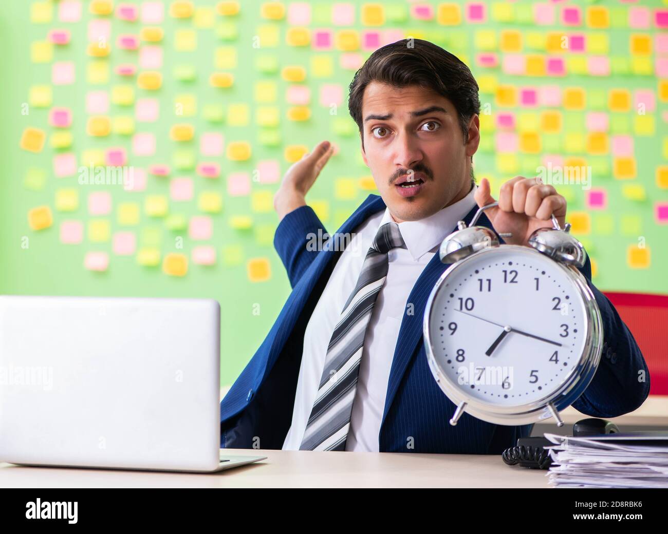 The businessman with many conflicting priorities in time management ...