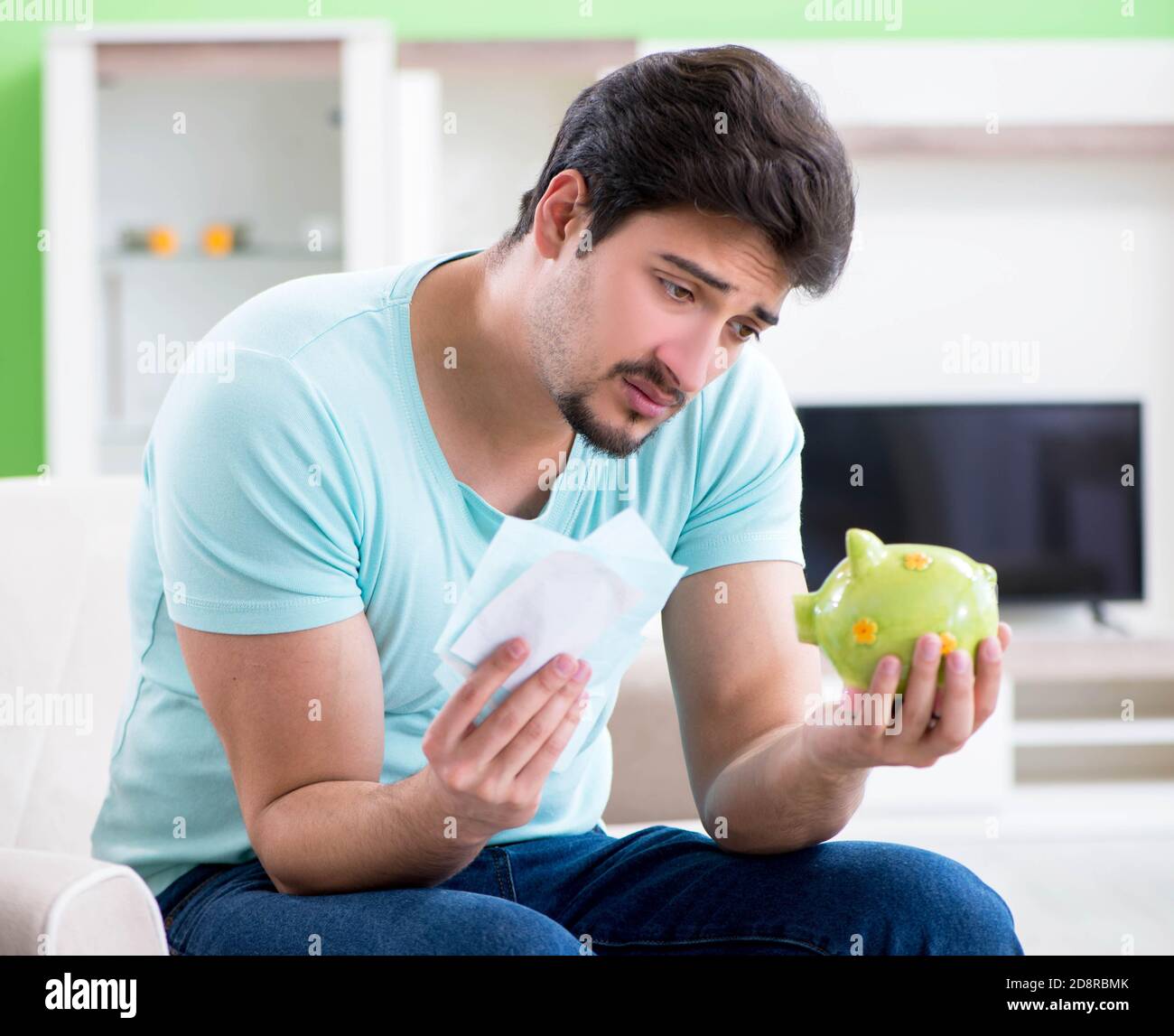 The young man struggling with personal finance and bills Stock Photo ...
