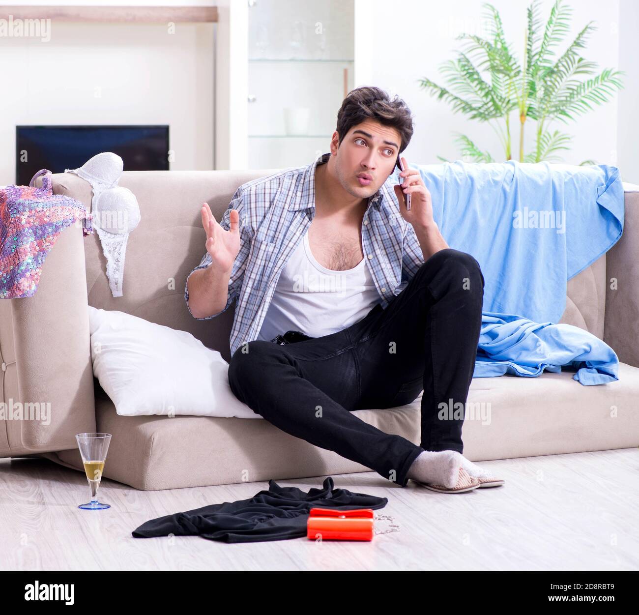 The man with mess at home after house party Stock Photo - Alamy