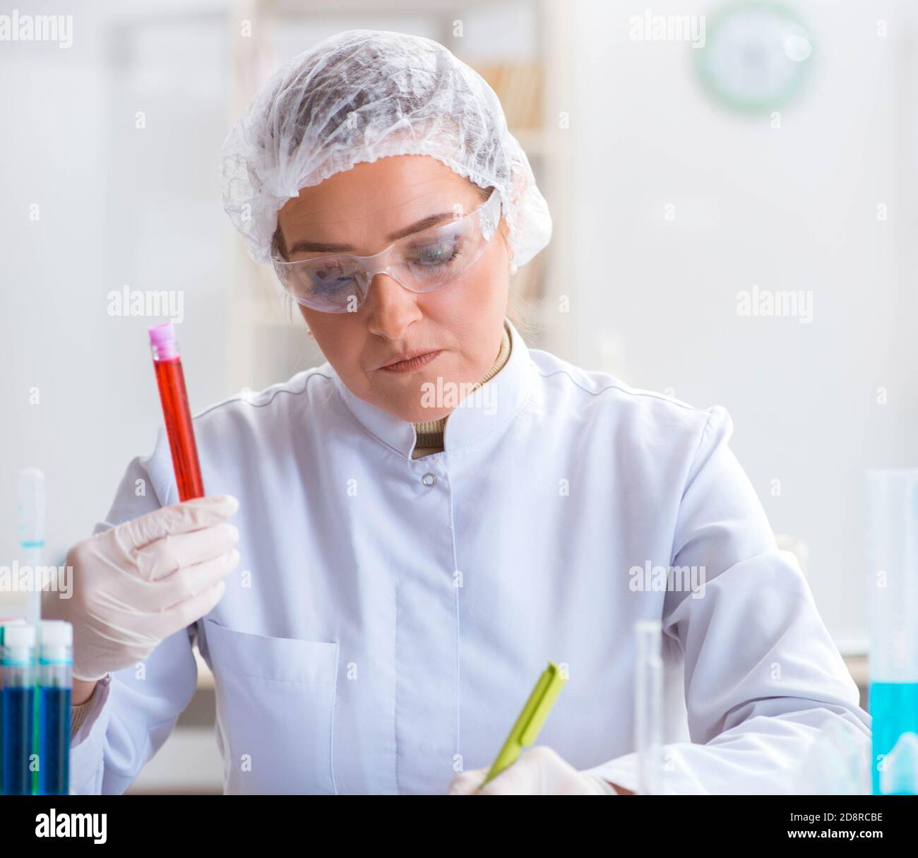 The woman doctor checking blood samples in lab Stock Photo - Alamy