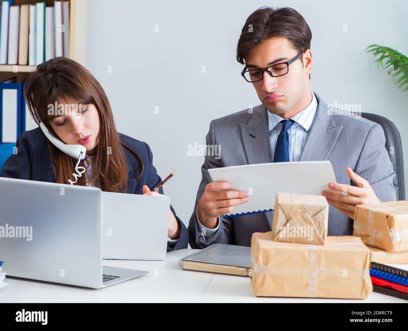 The business people receiving new mail and parcels Stock Photo - Alamy
