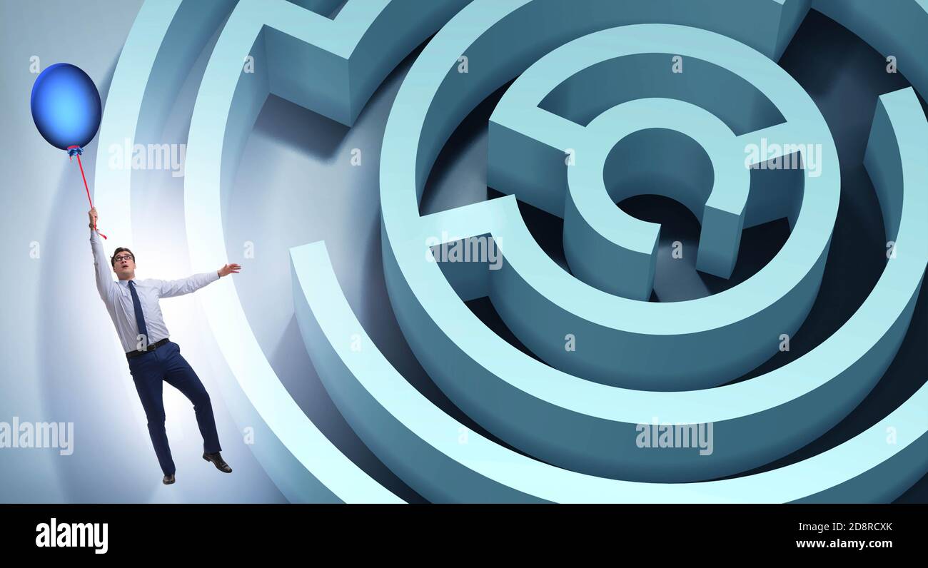 The businessman escaping from maze on balloon Stock Photo - Alamy