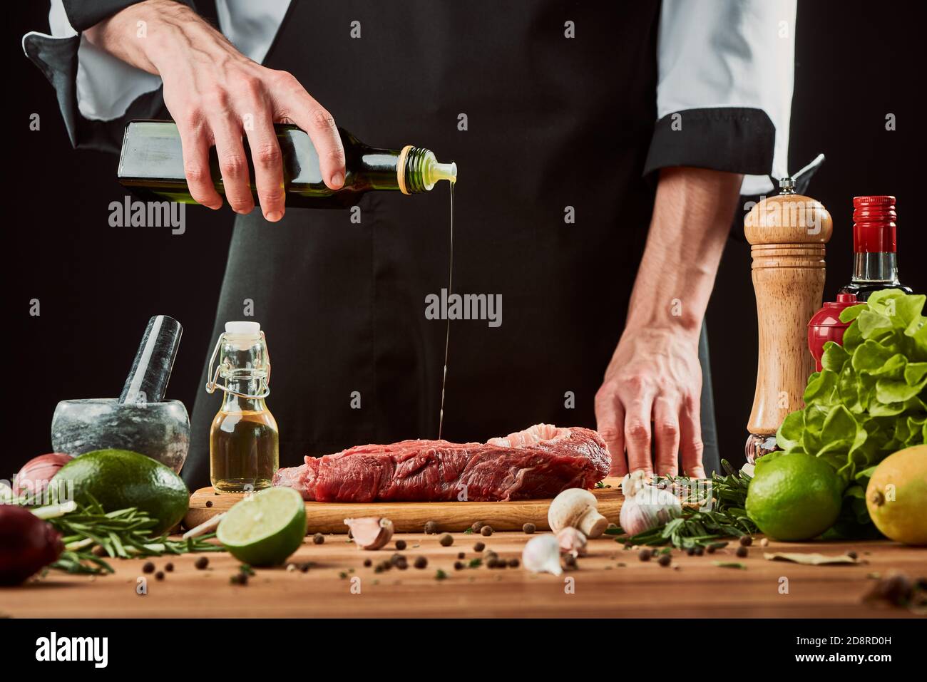 Chef pouring olive oil hi-res stock photography and images - Alamy