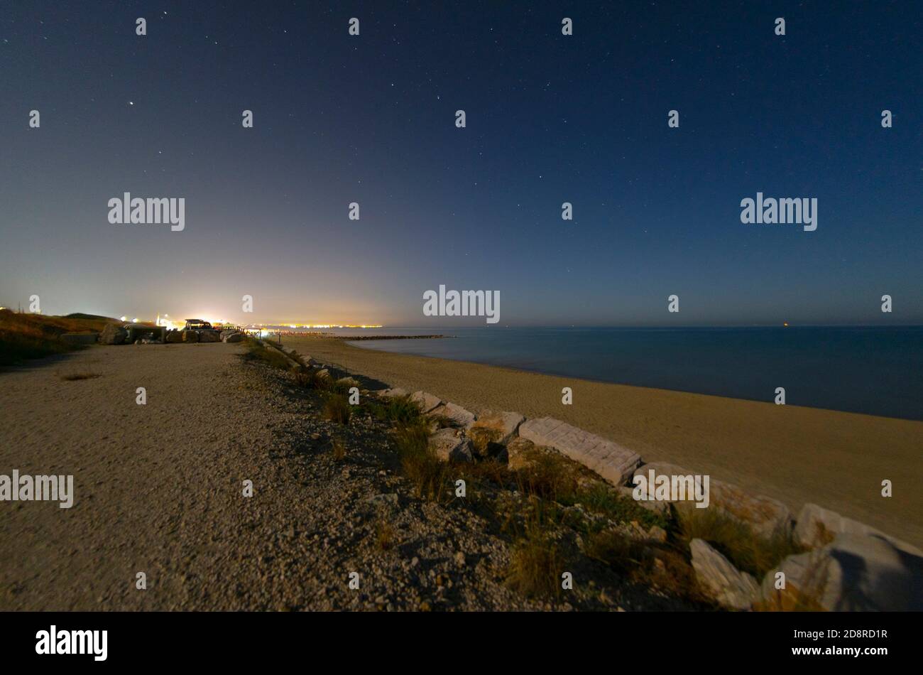 Night seascape with lights in the distance Stock Photo - Alamy