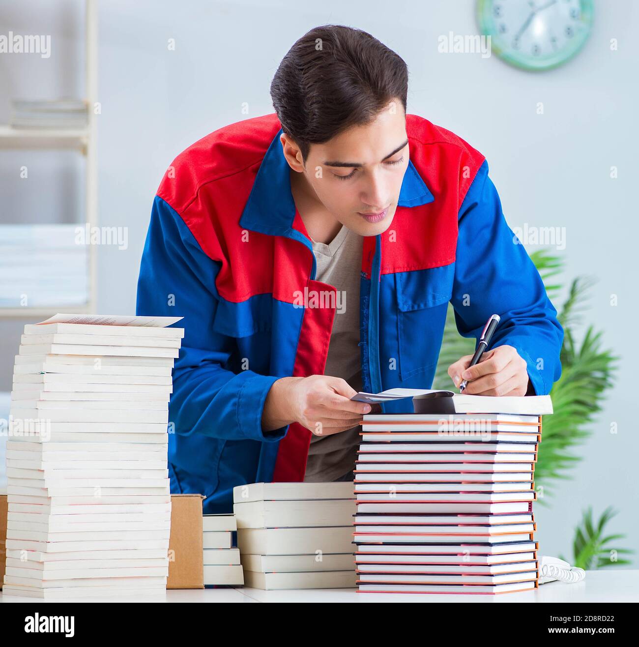 The worker in publishing house preparing book order Stock Photo - Alamy