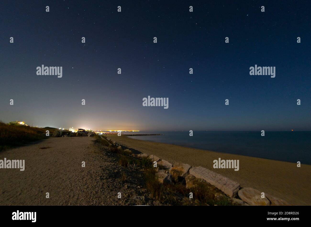 Night seascape with lights in the distance Stock Photo - Alamy