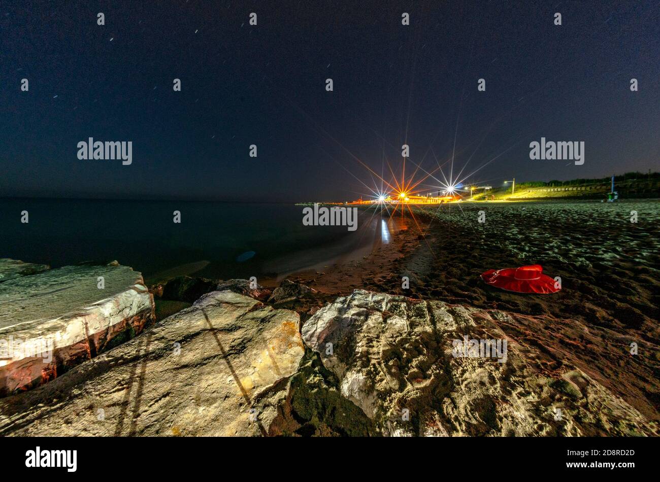 Night seascape with lights in the distance Stock Photo - Alamy