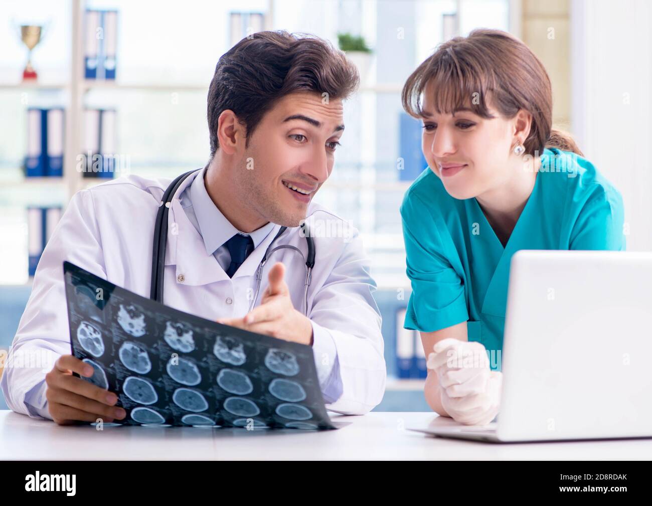 The two doctors discussing x-ray mri image in hospital Stock Photo - Alamy