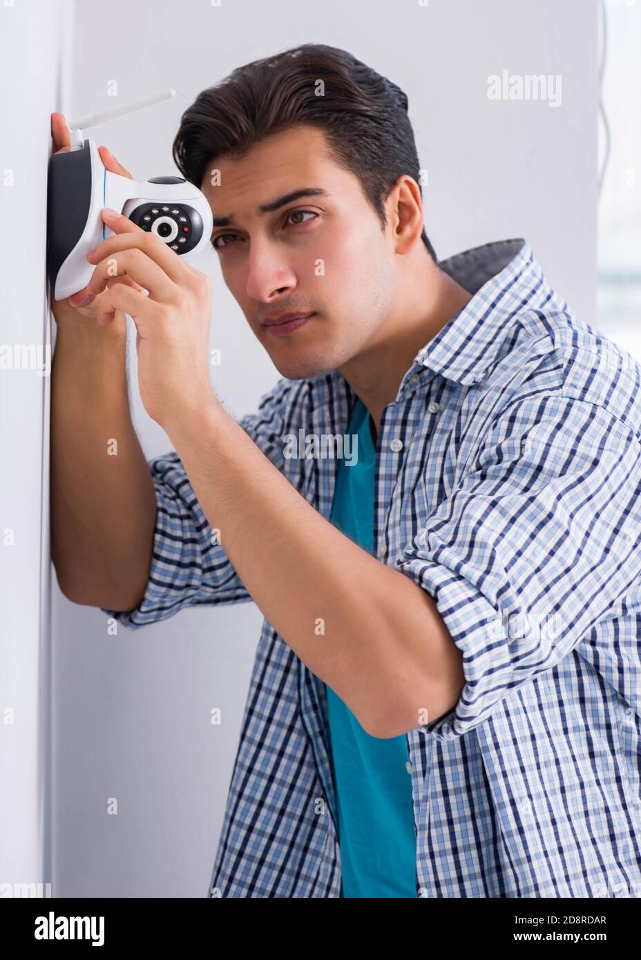 The man installing surveillance cctv cameras at home Stock Photo - Alamy