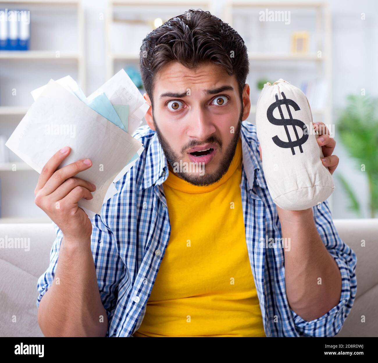 The man angry at bills he needs to pay Stock Photo - Alamy