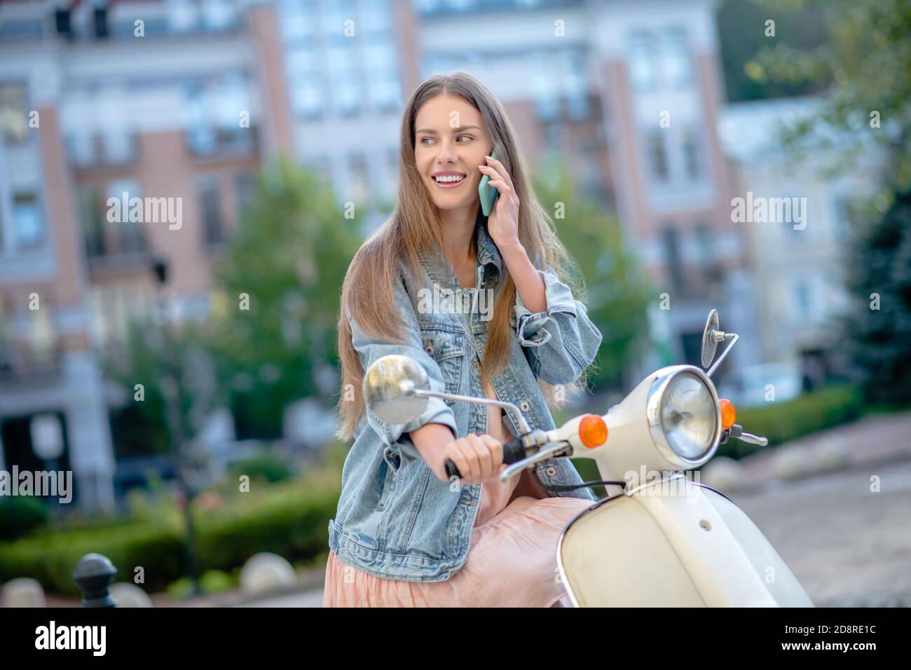 Lady riding scooter hi-res stock photography and images - Alamy