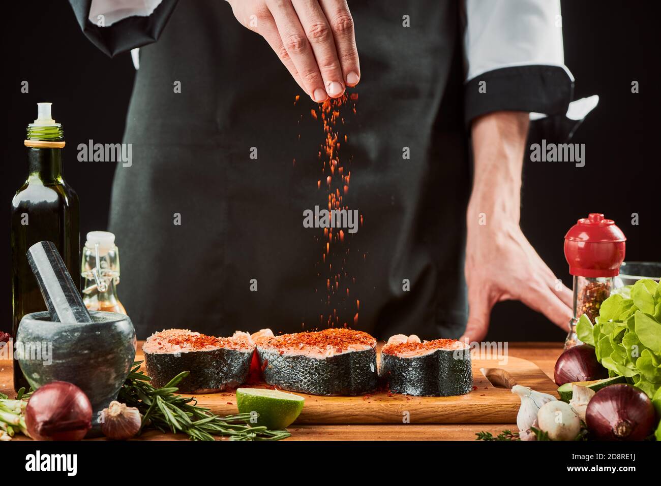 Person seasoning fish lemon table hi-res stock photography and images ...