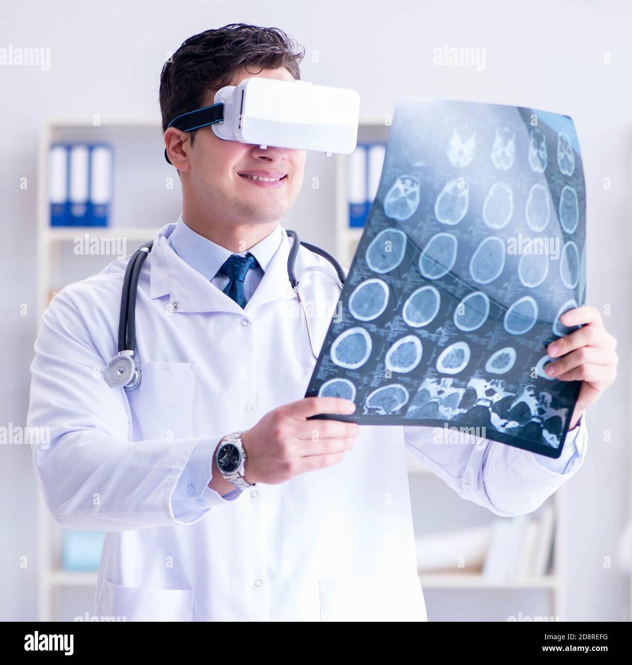 The young doctor looking at mri scan through vr glasses Stock Photo - Alamy