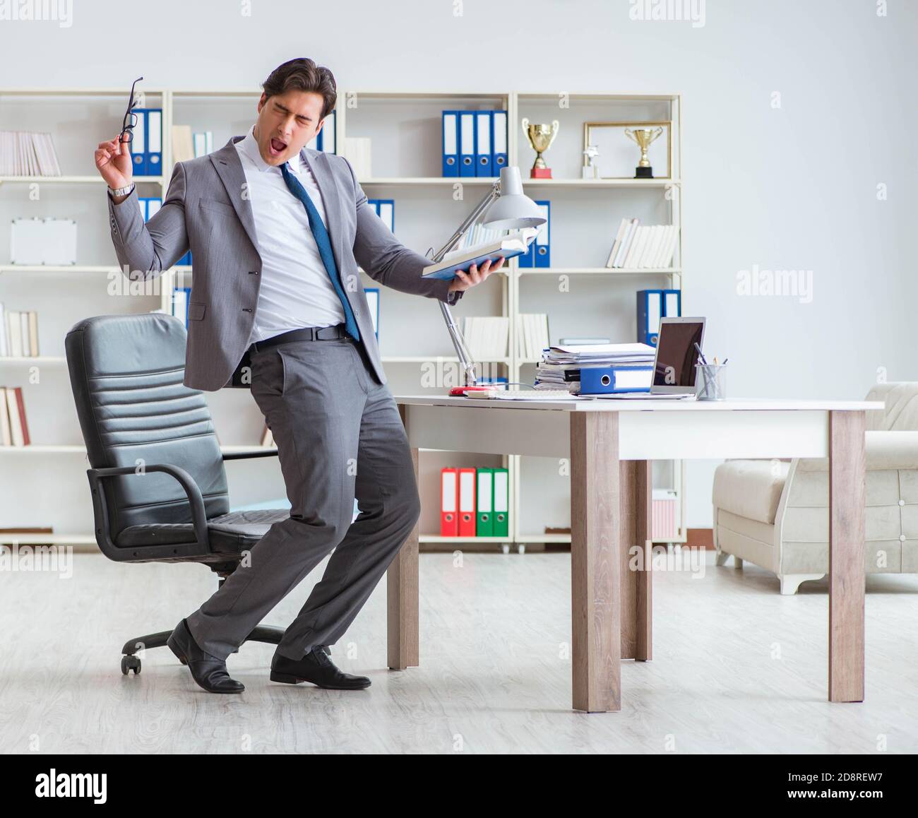 The businessman having fun taking a break in the office at work Stock ...