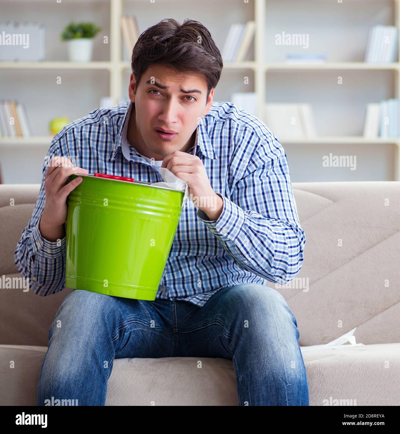Man vomiting bucket hi-res stock photography and images - Alamy