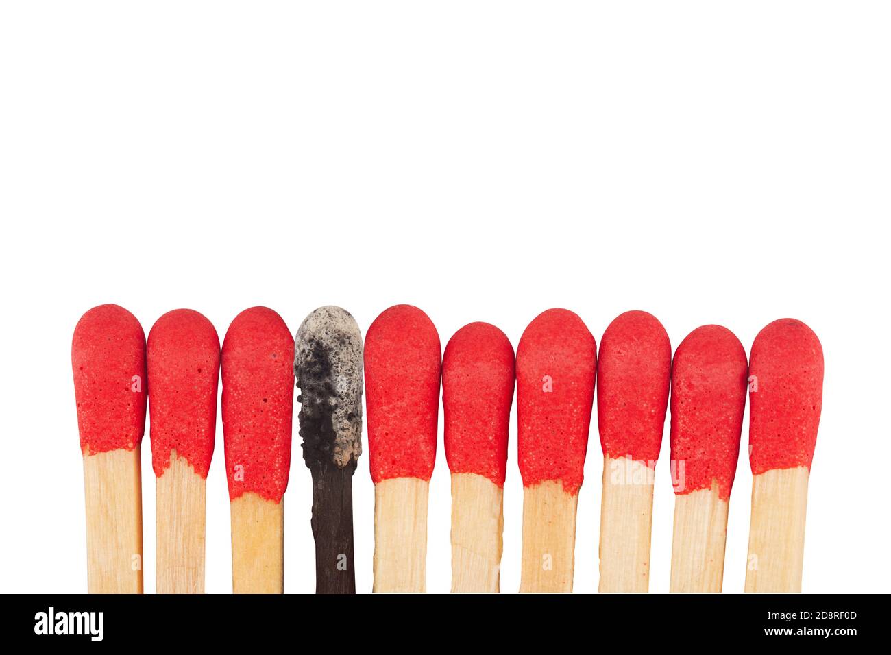 front view macro closeup of red wooden match sticks heads with a burnt ...