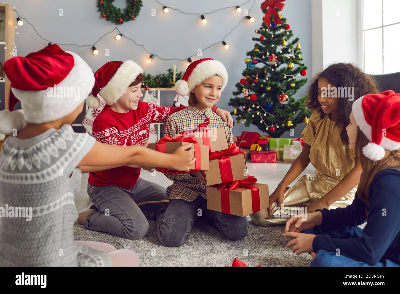 Children with gifts hi-res stock photography and images - Alamy