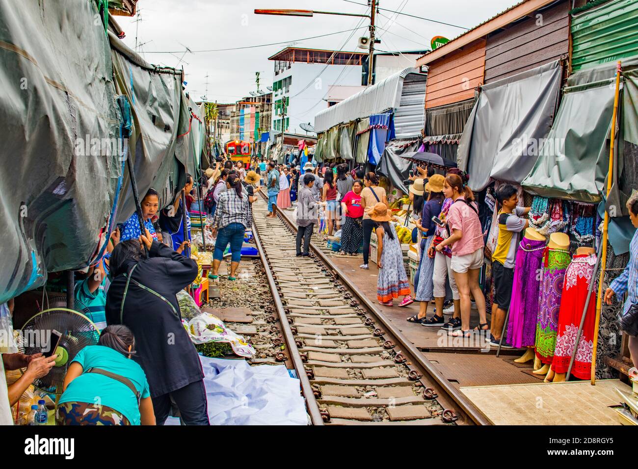 The Maeklong Railway Market or Hoop Rom Market in Thailand Southeast ...
