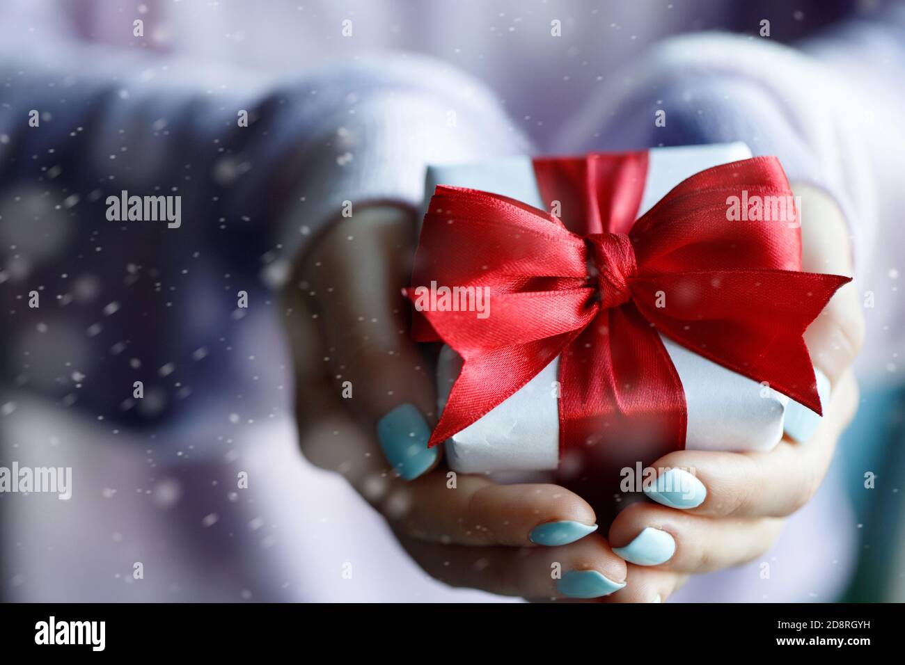 Female hand red bow hi-res stock photography and images - Alamy