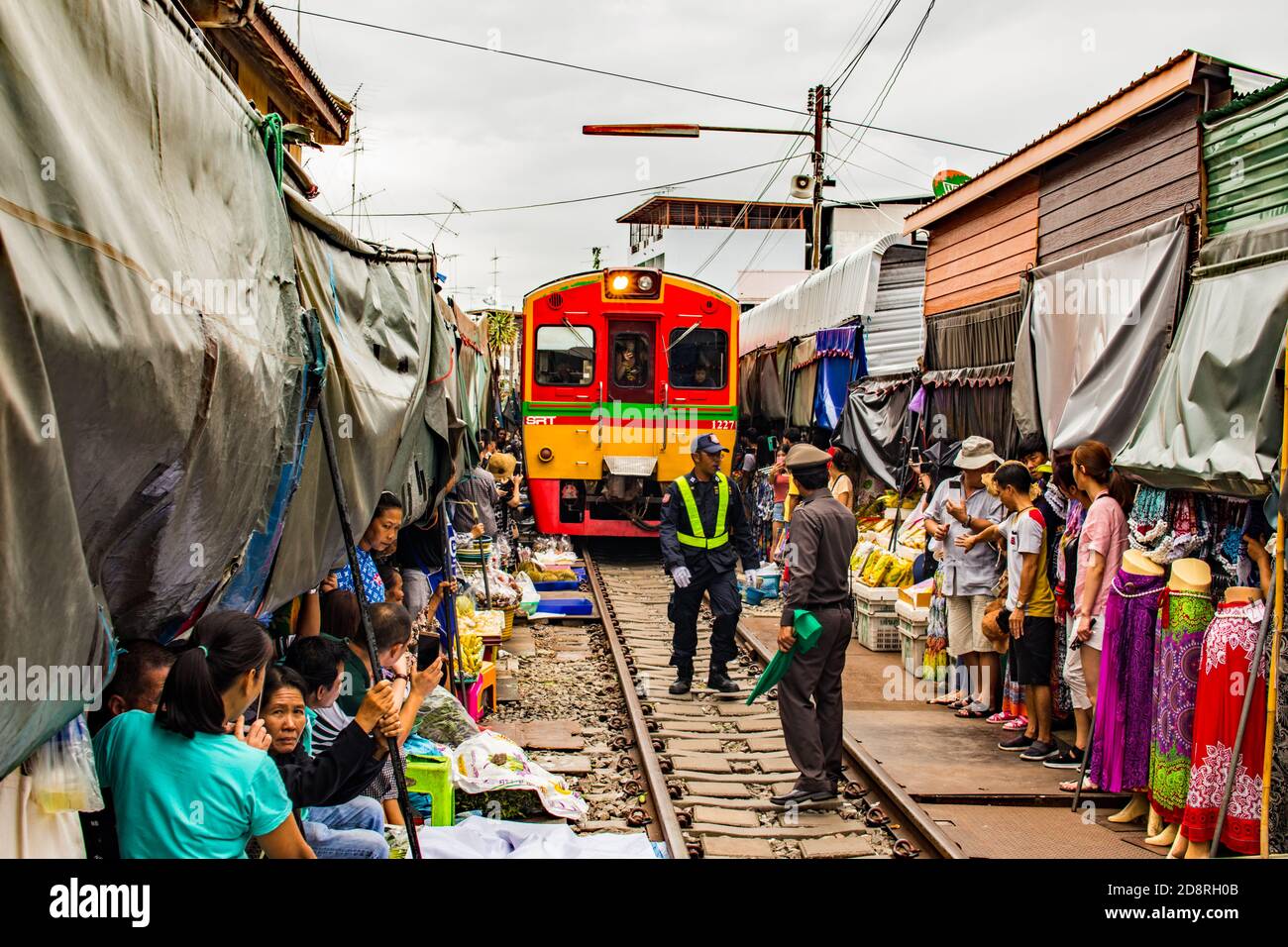 The Maeklong Railway Market or Hoop Rom Market in Thailand Southeast ...