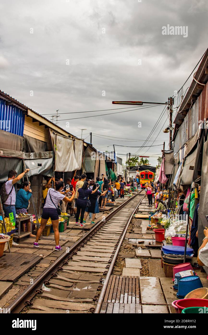 The Maeklong Railway Market or Hoop Rom Market in Thailand Southeast ...