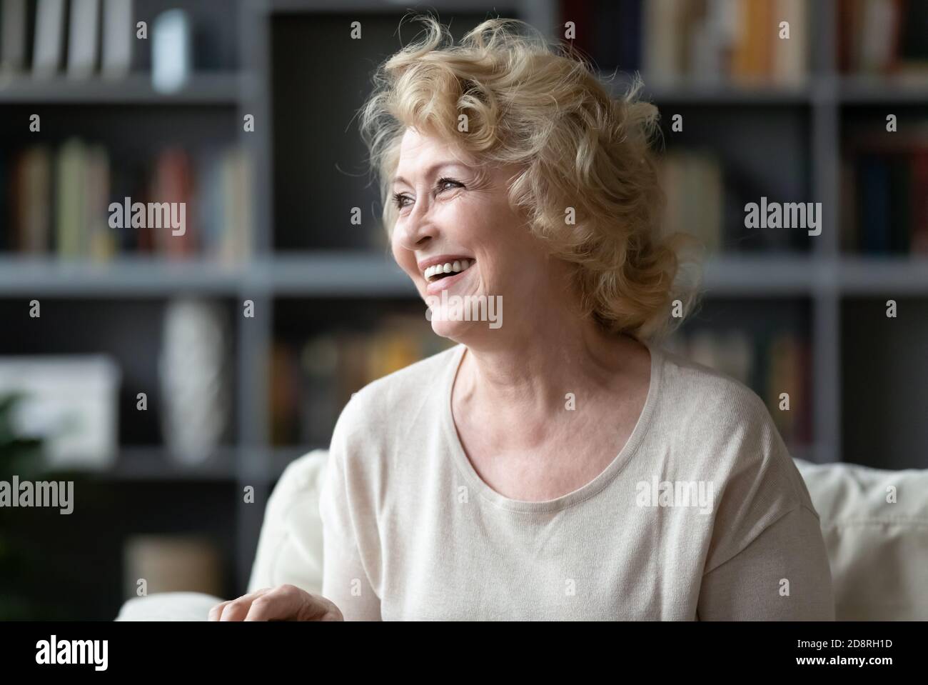 Happy 60s elderly woman looking at distance Stock Photo - Alamy