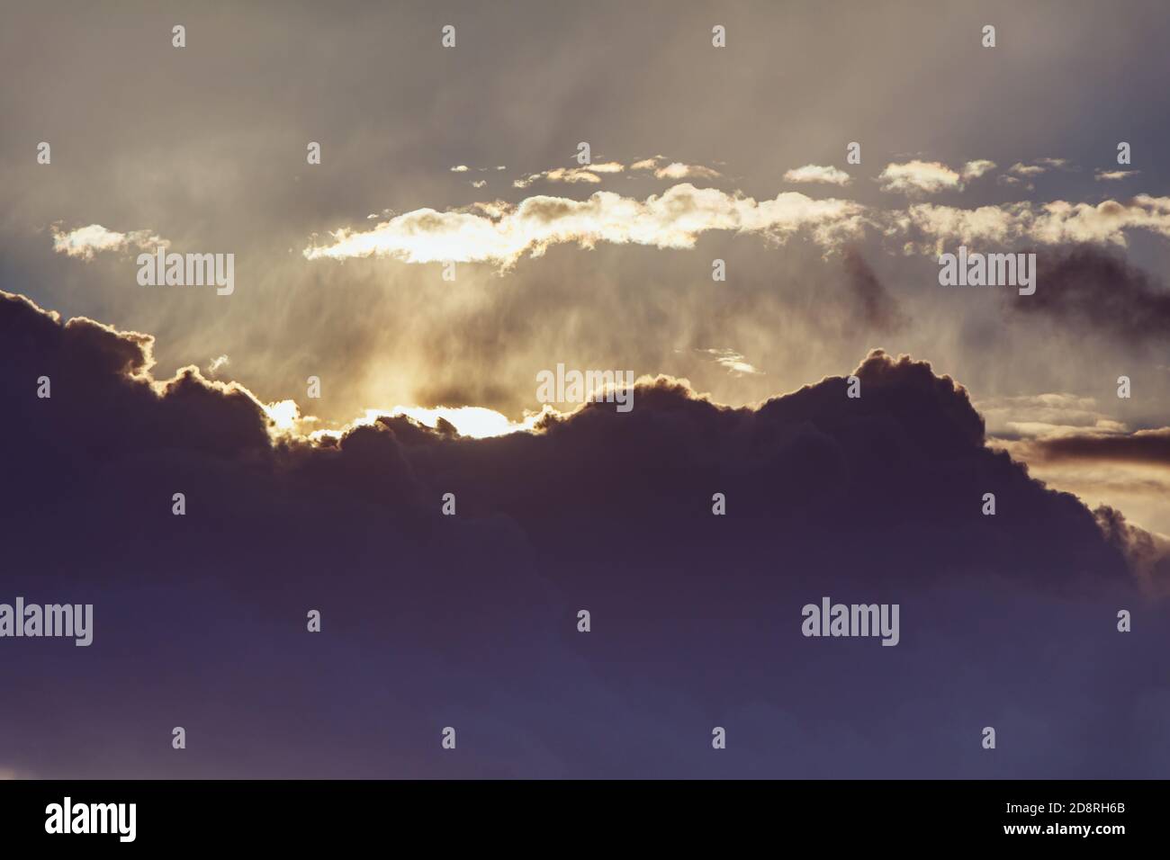 The sun disappeared behind some cloud cover Stock Photo - Alamy