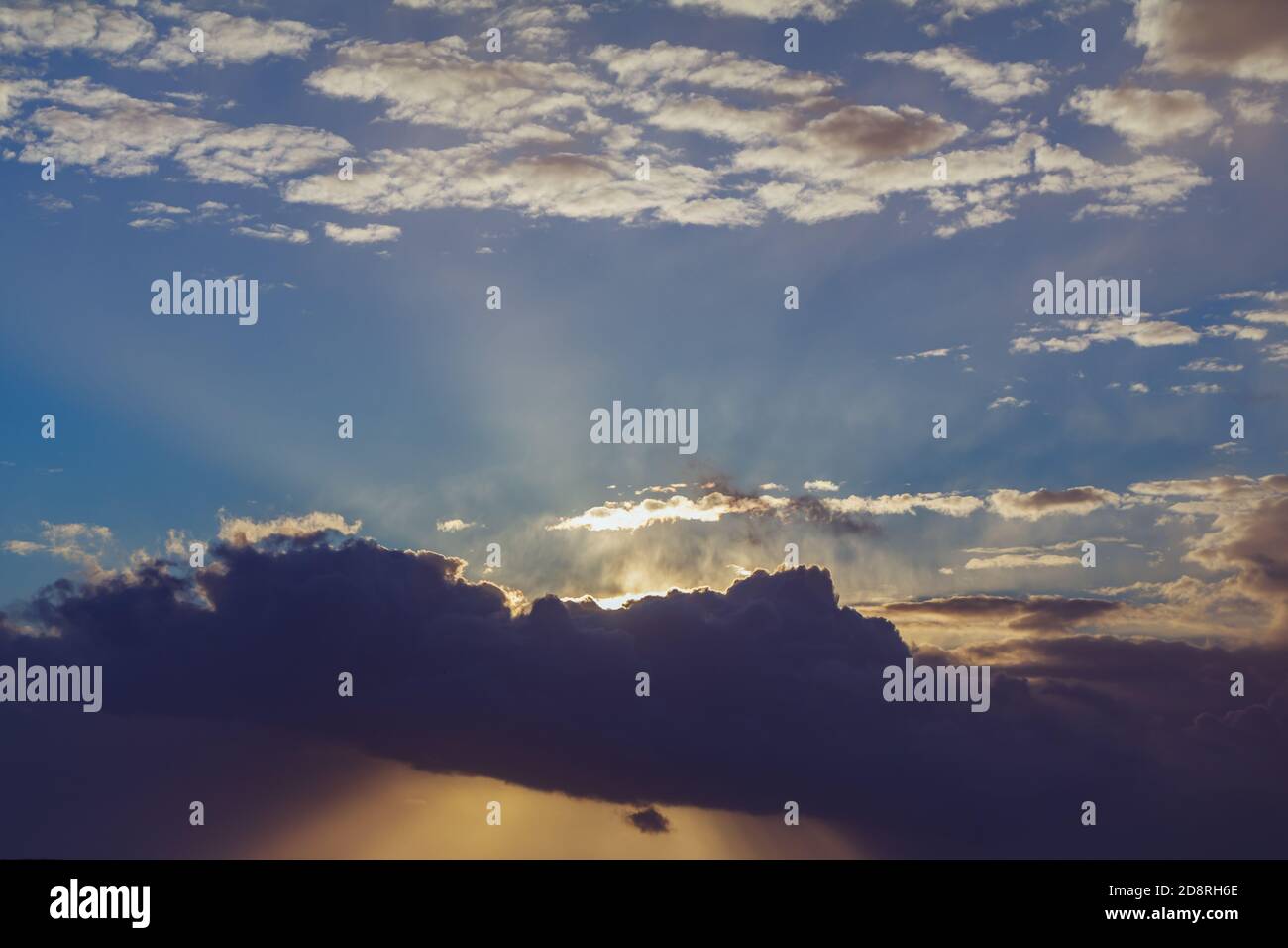 The sun disappeared behind some cloud cover Stock Photo - Alamy