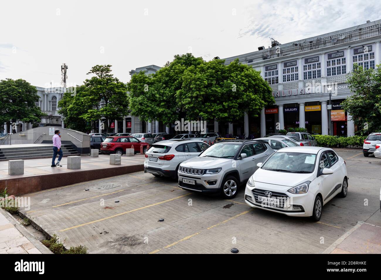 View of vehicles, road and buildings at Connaught Place in central ...