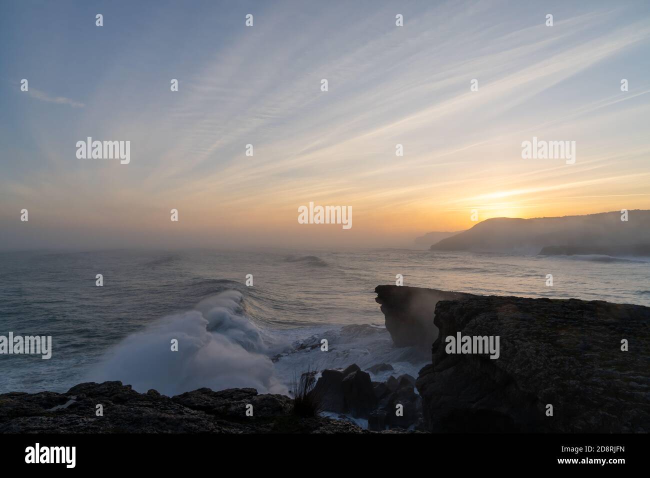 A view of huge storm surge ocean waves crashing onto shore and cliffs ...