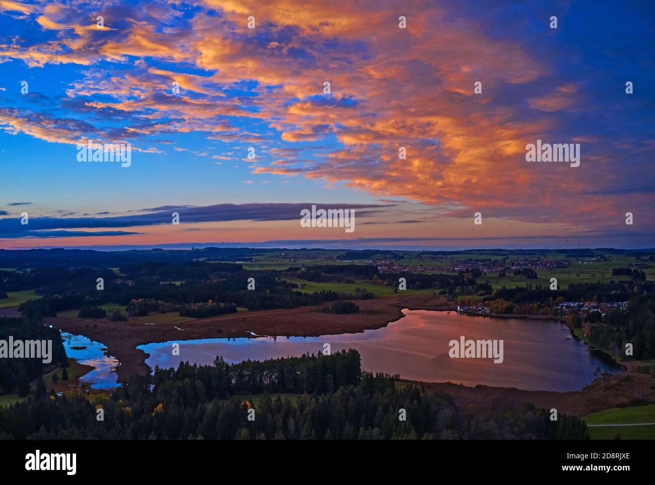 Aerial photo of sunset behind lake ELBSEE in Aitrang, Bavaria, Germany ...