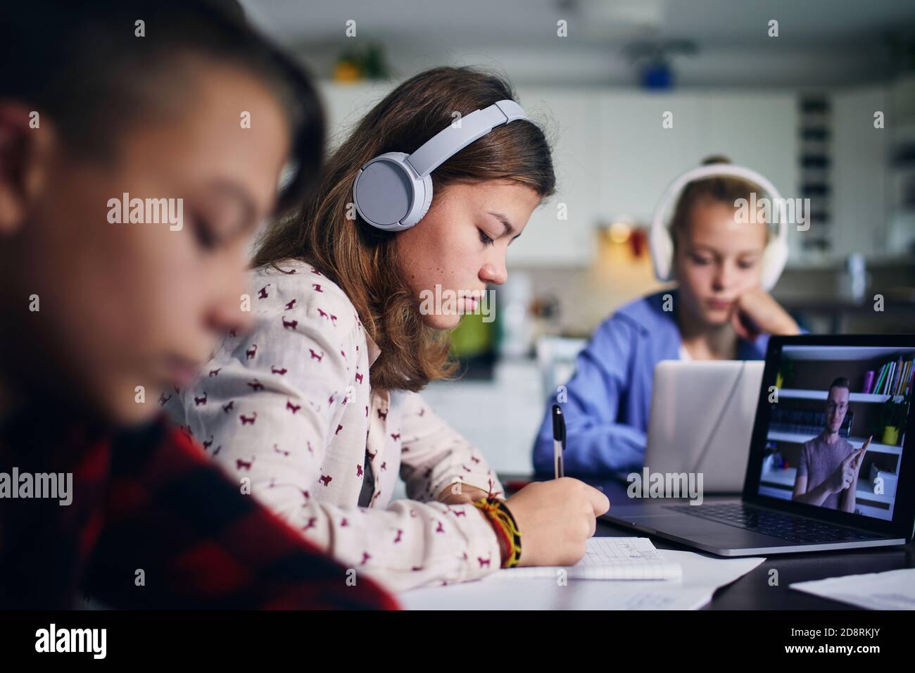 Online school lesson. Children learning via internet with laptops at ...