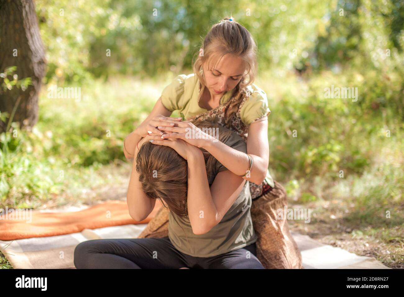 Woman Masseuse Provides A Thorough Massage On The Forest Floor Stock 6771