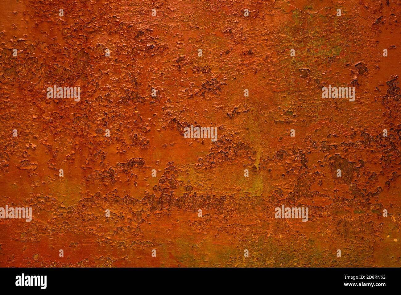 Abstract colorful image painted in orange on an outdoor rotten metal ...